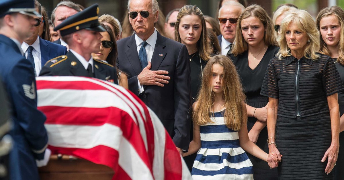 Vice President Joe Biden puts his hand on his heart as he and ...